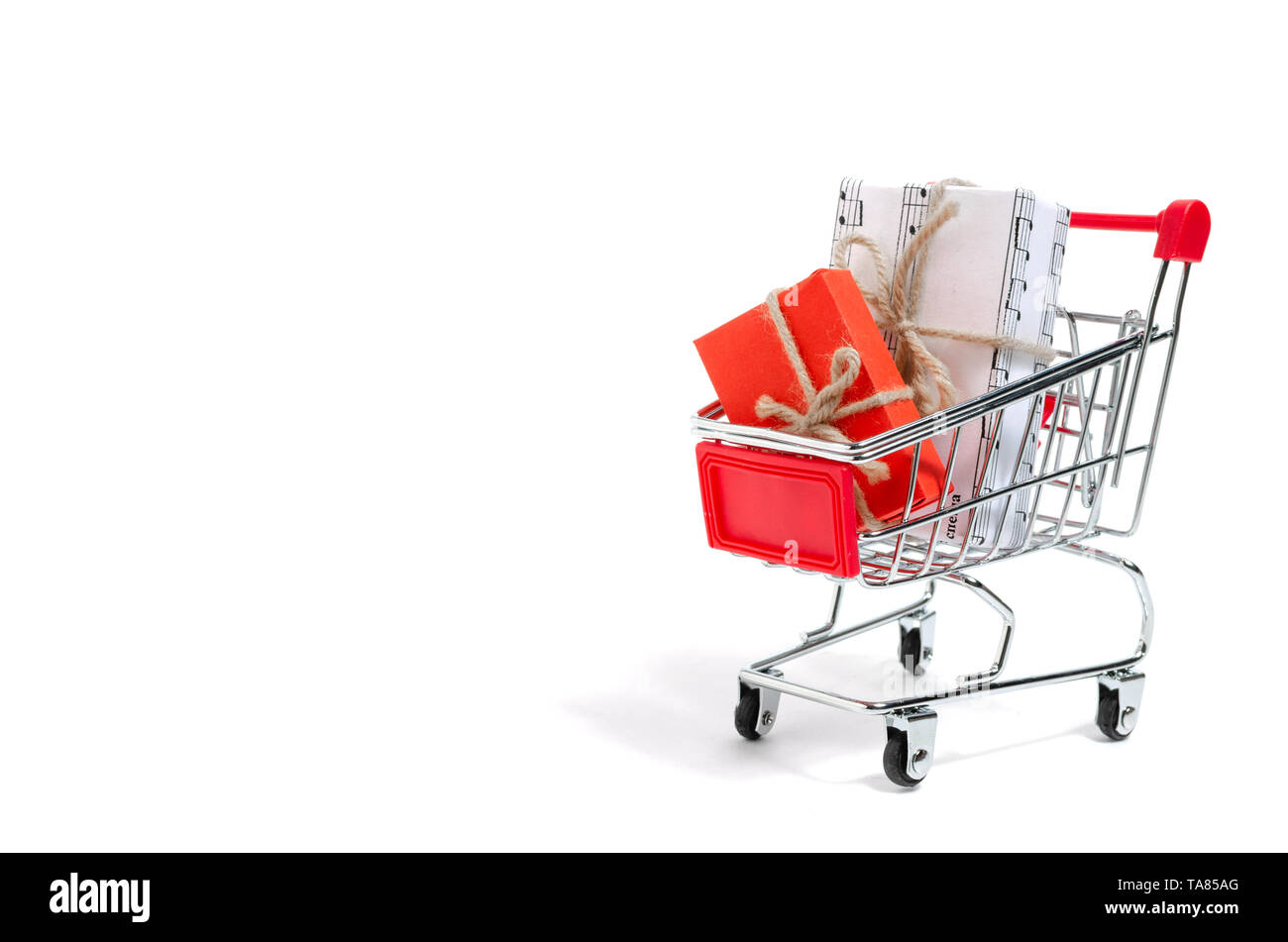 Shopping cart filled with gifts on white background Stock Photo - Alamy