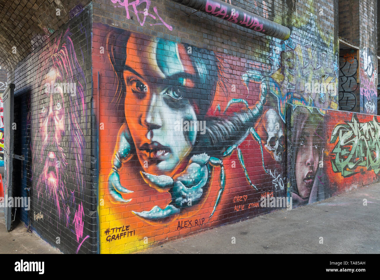 Street art and graffiti painted on the walls of railway arches in the ...