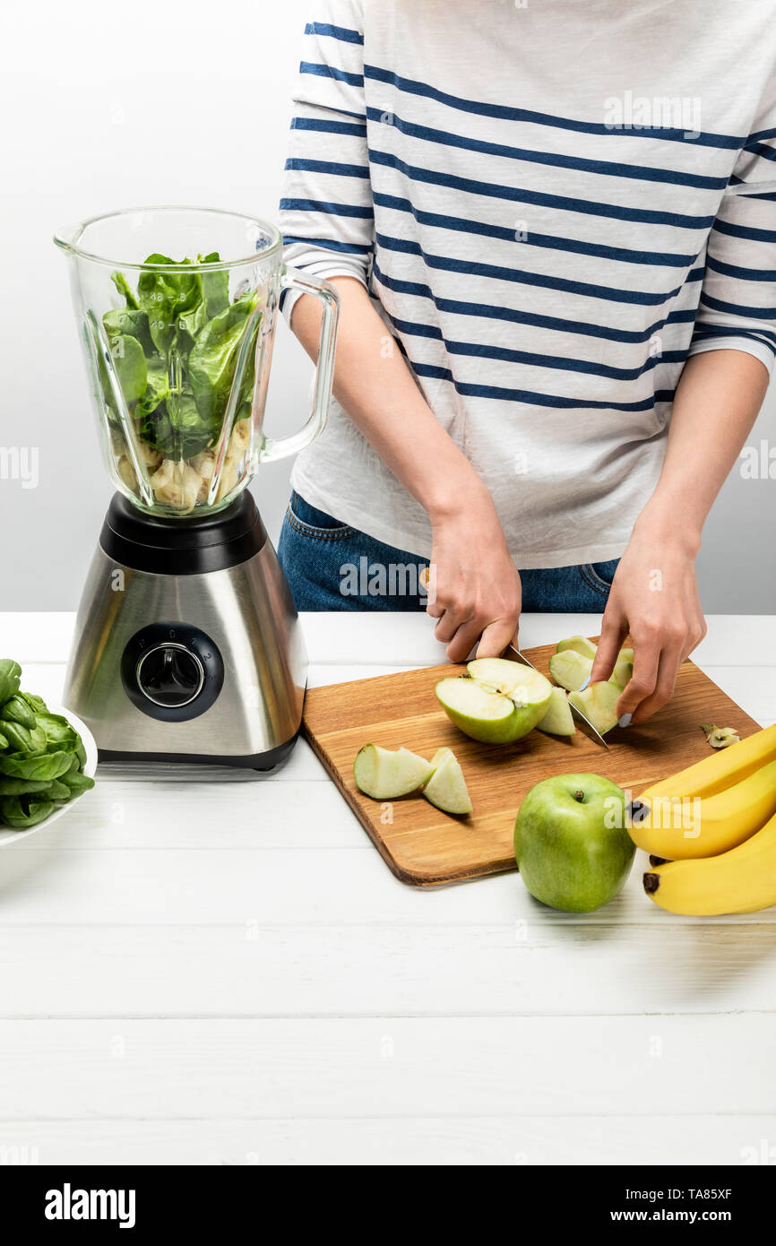 Woman cutting apple on slices hi-res stock photography and images - Alamy