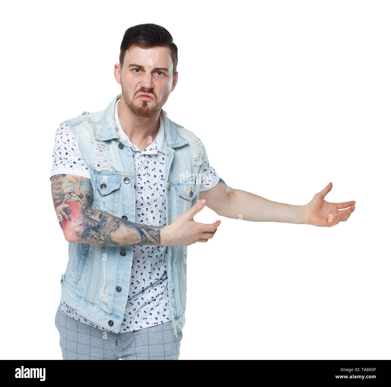 The man screams. Aggressive guy in tattoos yelling at the frame and ...