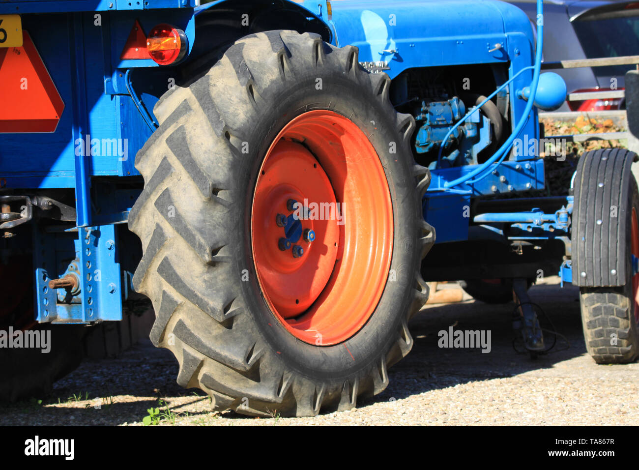 Close up of black wheels tire with deep sufficient tread and engine of ...