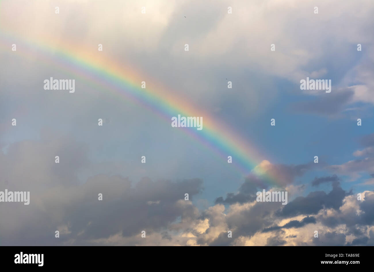Rainbow in the spring cloudy sky after a thunderstorm and rain Stock ...