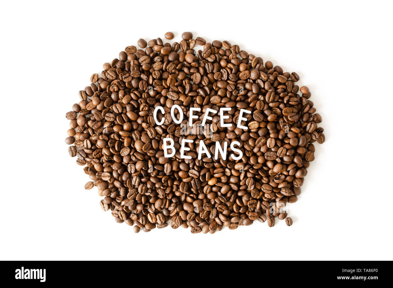Coffee beans on white background with white inscription in middle Stock ...