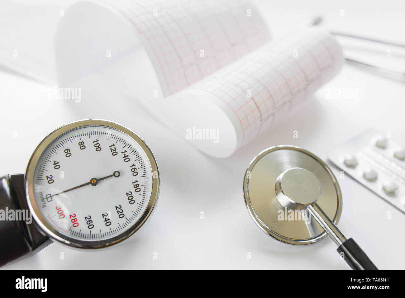 Medical concept: stethoscope, tonometer, tablets in blister and ...