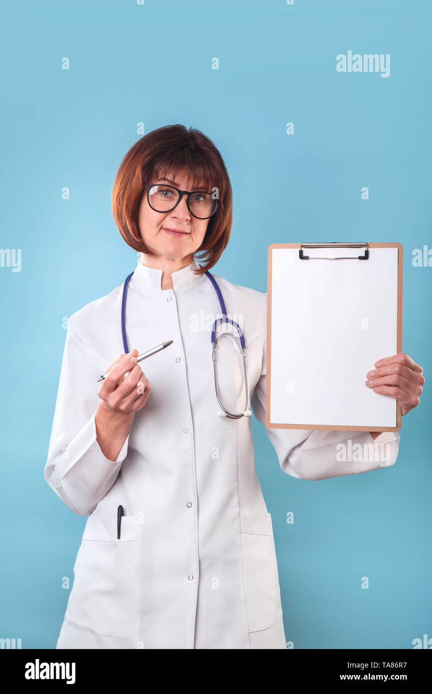 Doctor showing medical document notes on blue background Stock Photo ...