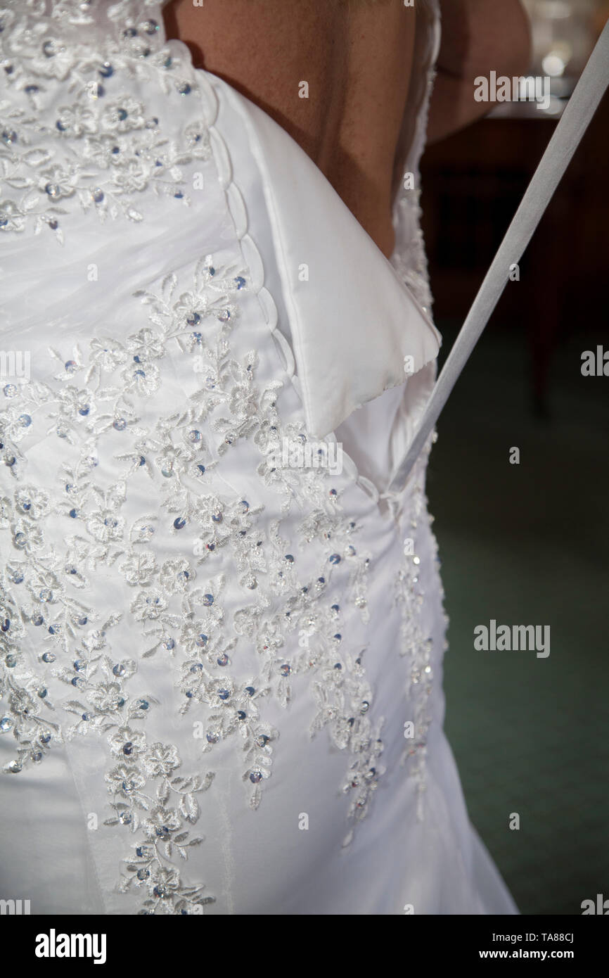 Brides dress being done up before she gets married, lacey brides dress ...