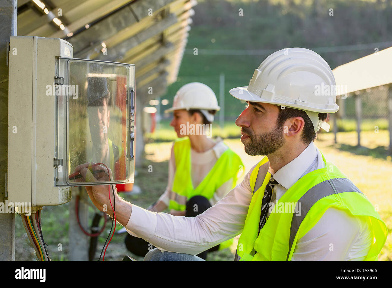 Engineers are testing the solar photovoltaic power generation Stock ...