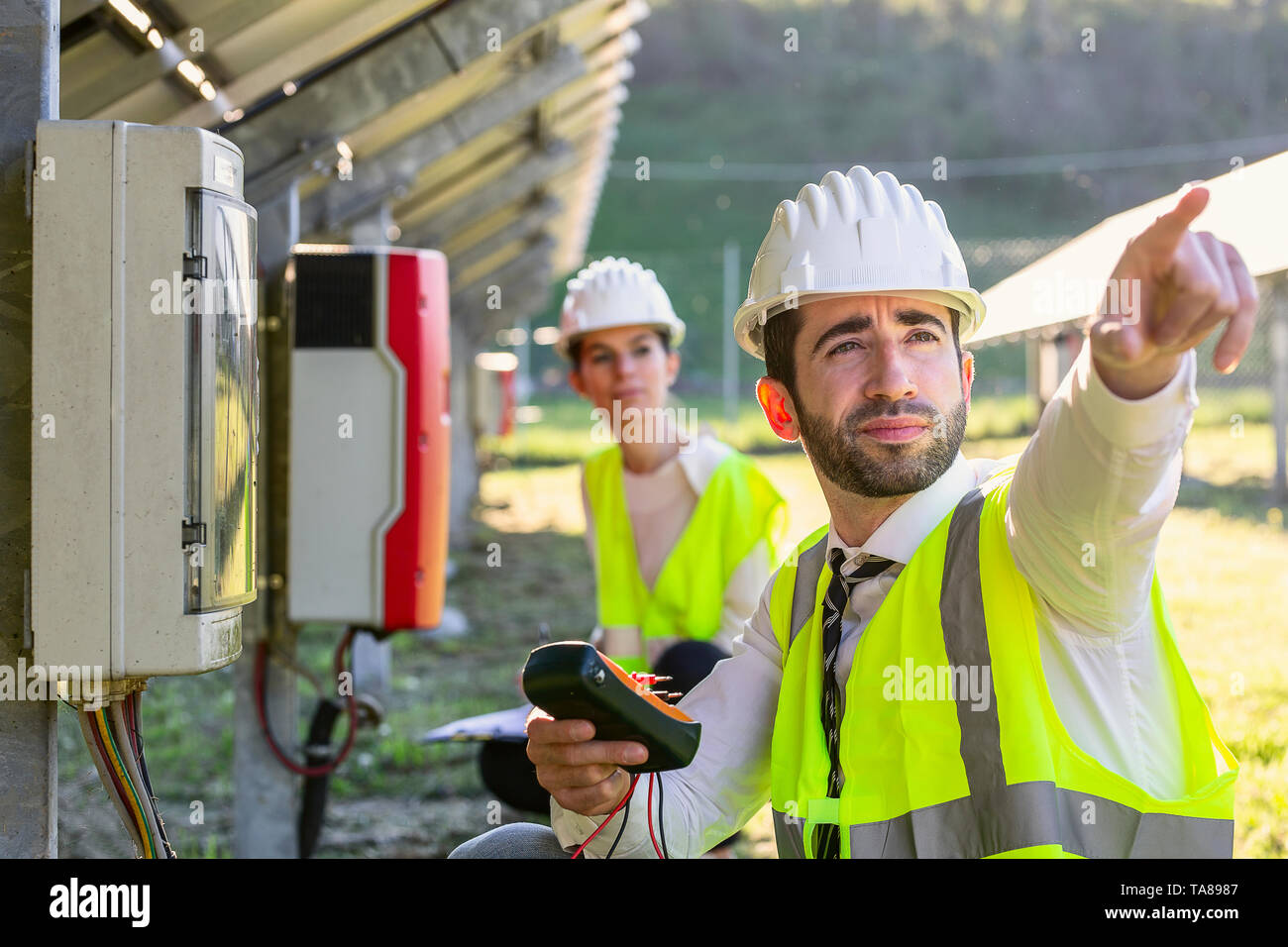 Engineers are testing the solar photovoltaic power generation Stock ...