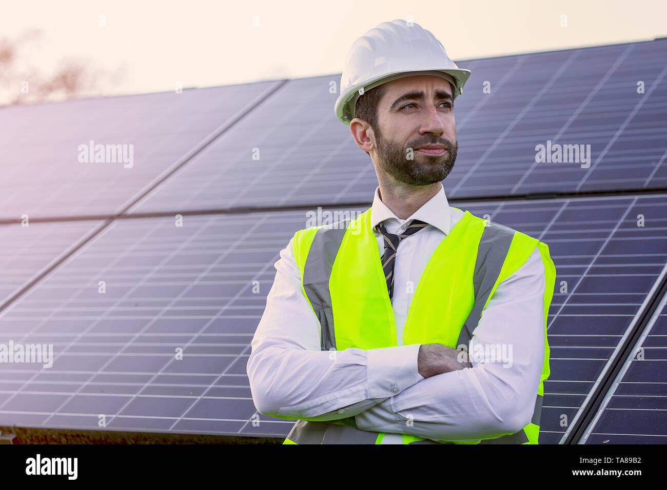 The portrait of a proud young engineer satisfied with his successful ...