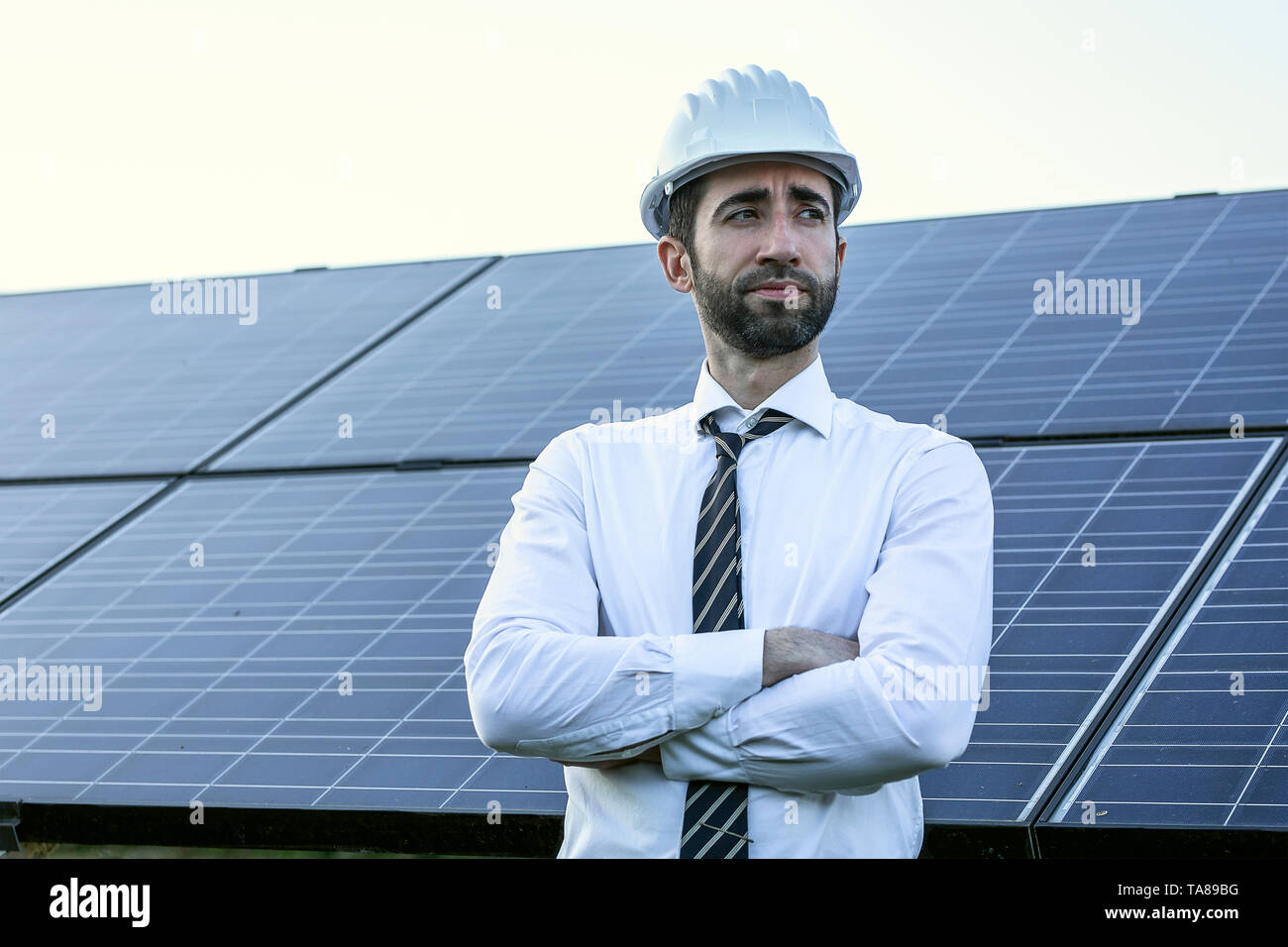 The portrait of a proud young engineer satisfied with his successful ...