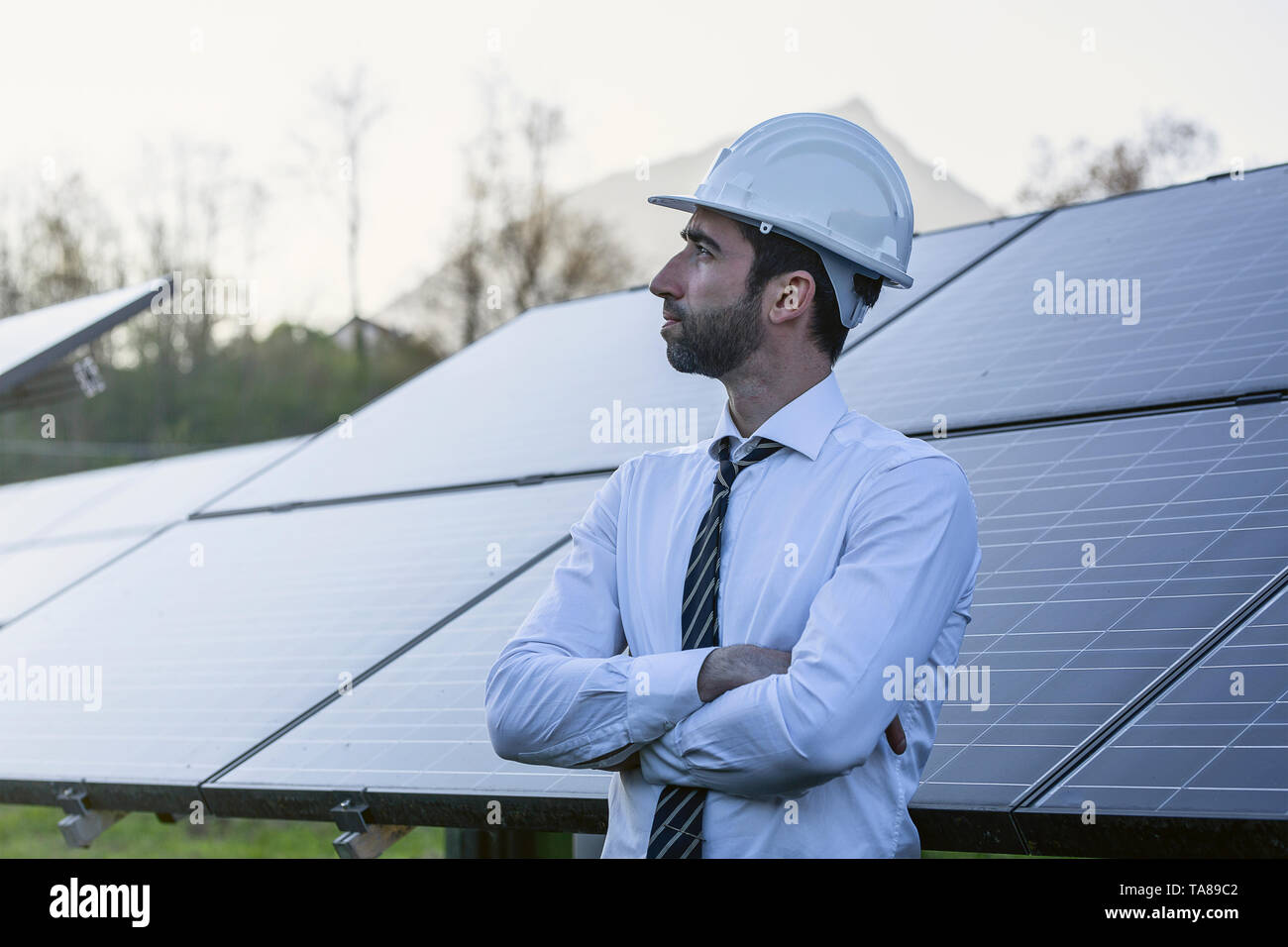 The portrait of a proud young engineer satisfied with his successful ...