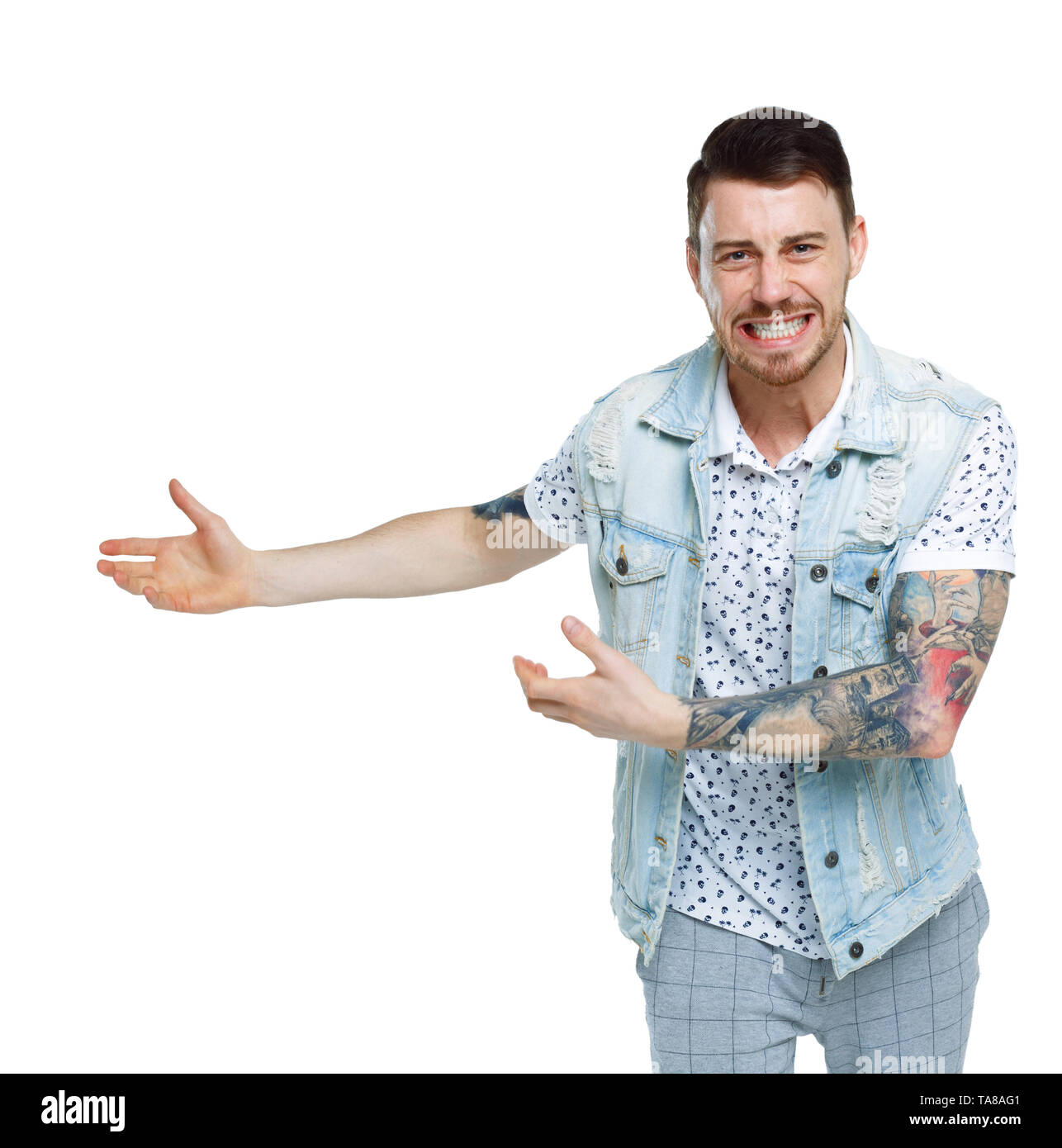 The man screams. Aggressive guy in tattoos yelling at the frame and ...