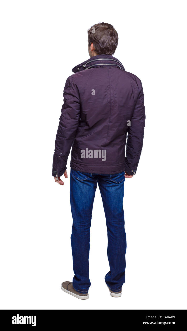 Back view of handsome man In long black jacket. Standing young guy in ...