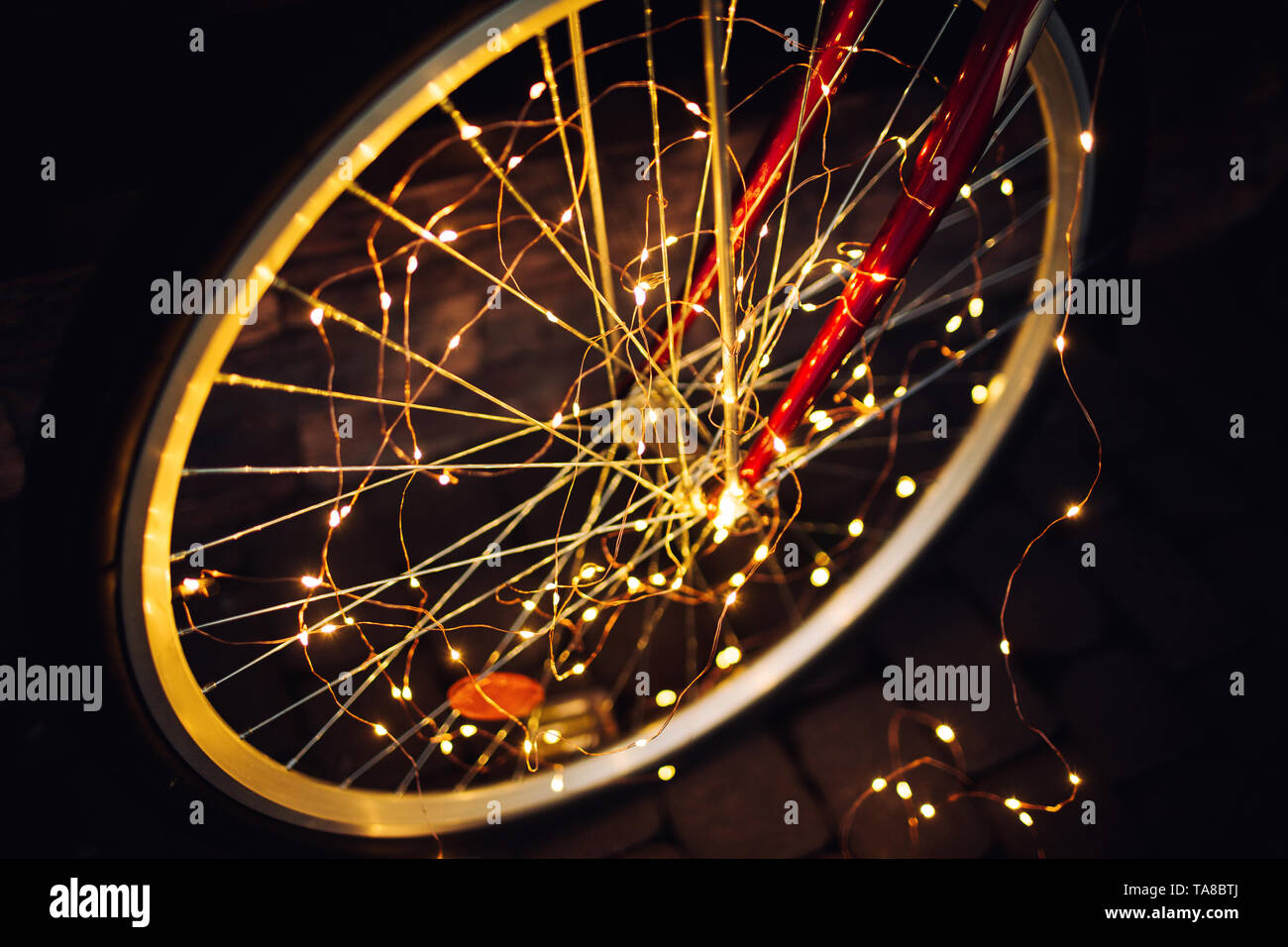 Christmas lights on bike background texture in city Stock Photo - Alamy