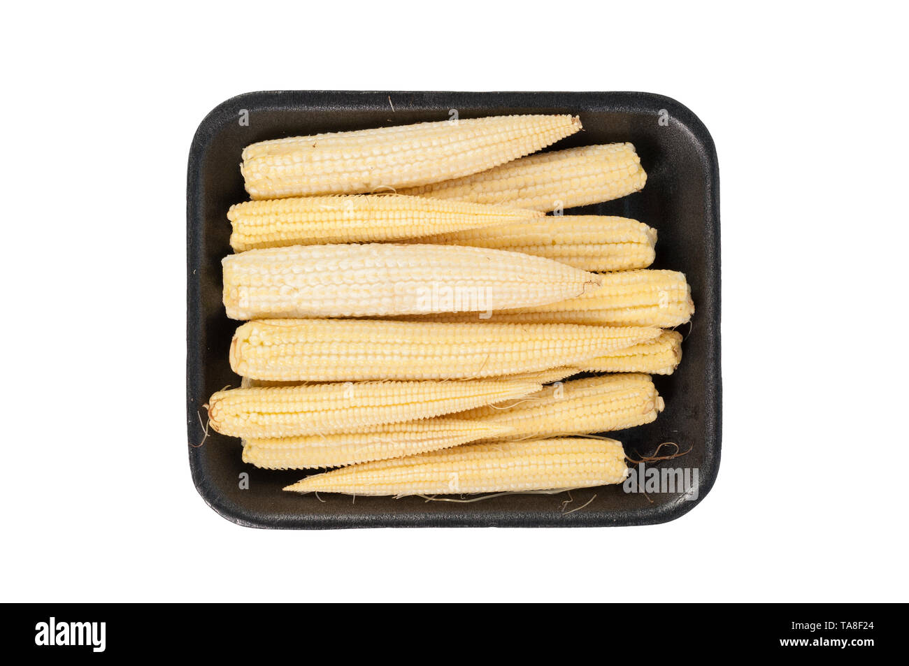 Close up baby corn in foam pack supermarket isolated on white ...