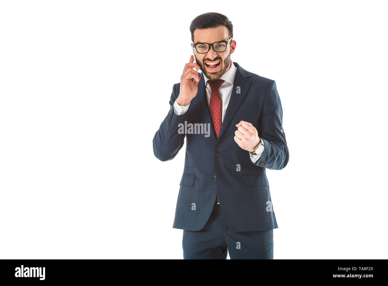 angry businessman screaming and showing fist while talking on ...