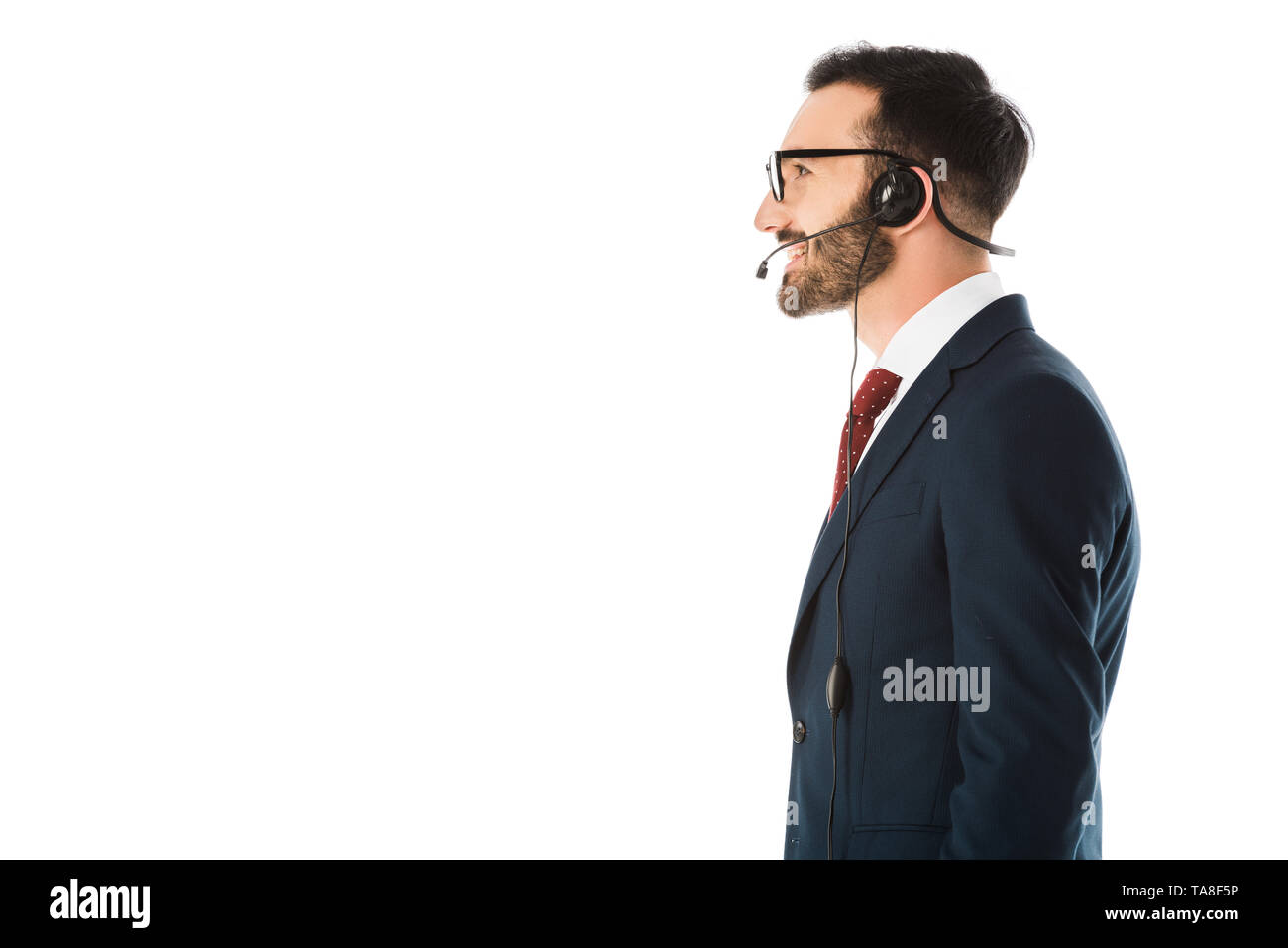 side view of call center operator in black suit and headset isolated on ...