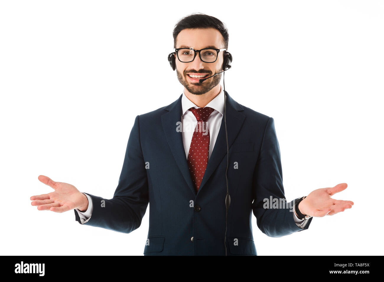 handsome call center operator in headset smiling and showing idea ...