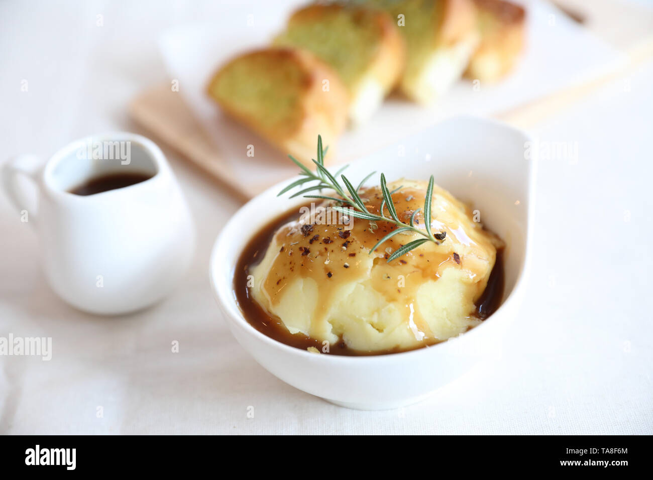 Mashed potato with gravy and bread Stock Photo - Alamy