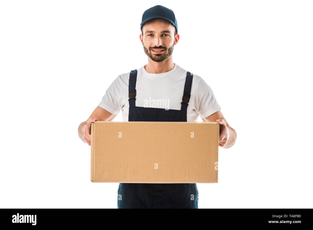 cheerful handsome delivery man holding cardboard box and smiling at ...