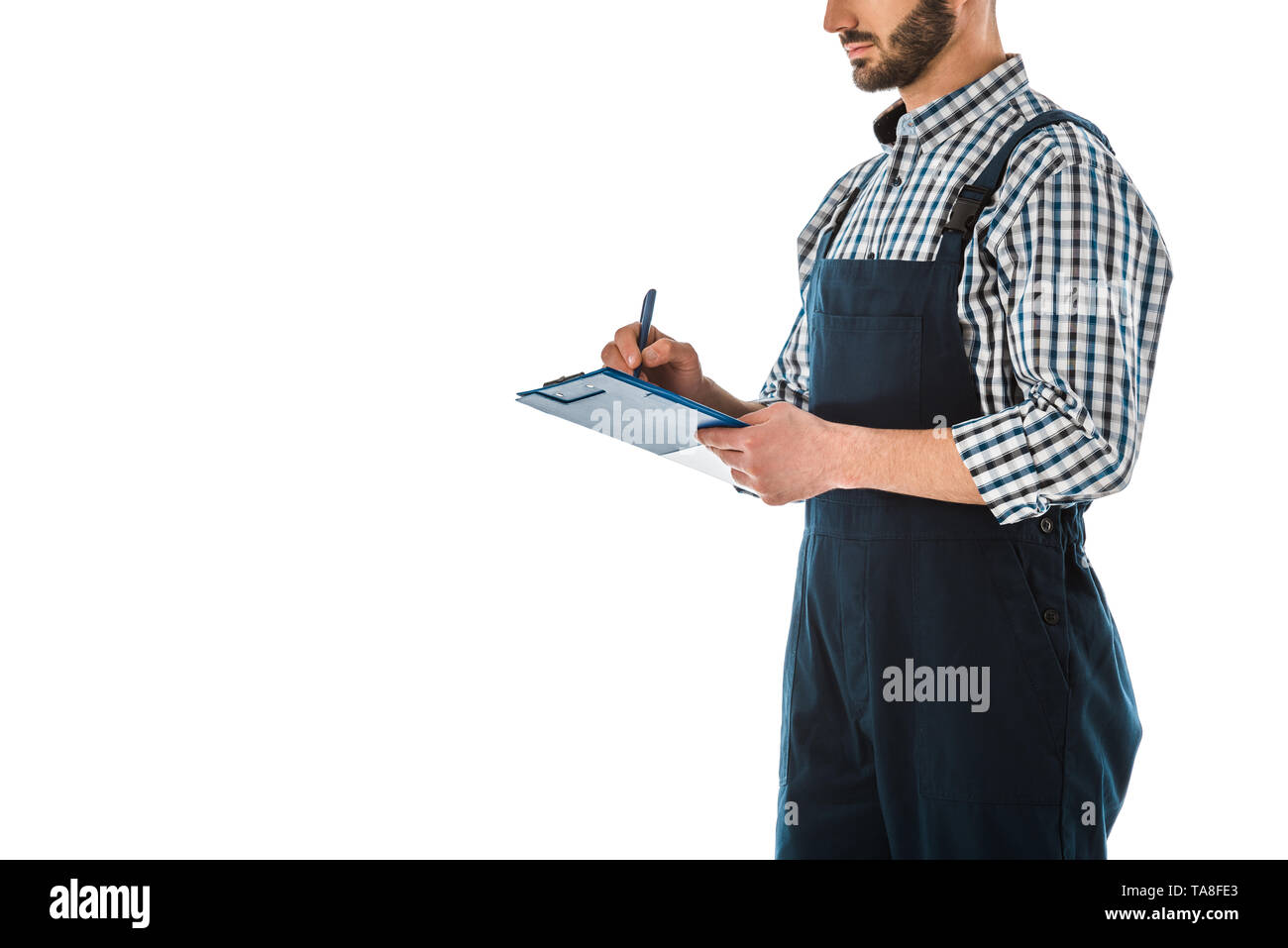partial view of construction worker writing on clipboard isolated on ...