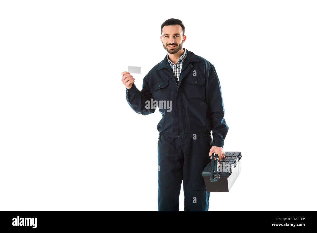 smiling workman in overalls holding toolbox and blank business card ...