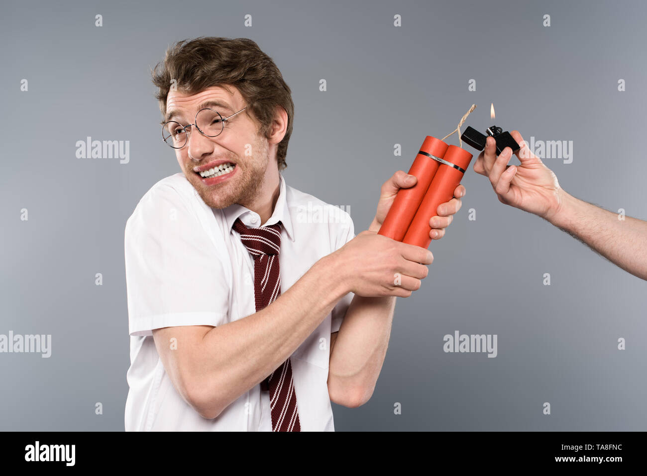 frightened man holding dynamite while another holding lighter with fire ...