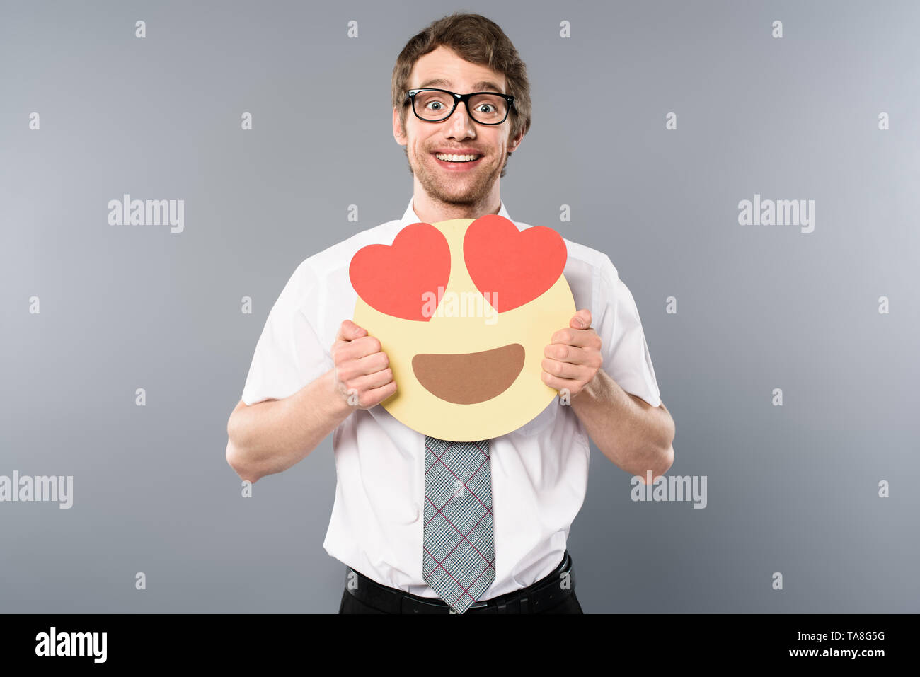 excited businessman holding smiling face with heart-eyes in hands Stock ...