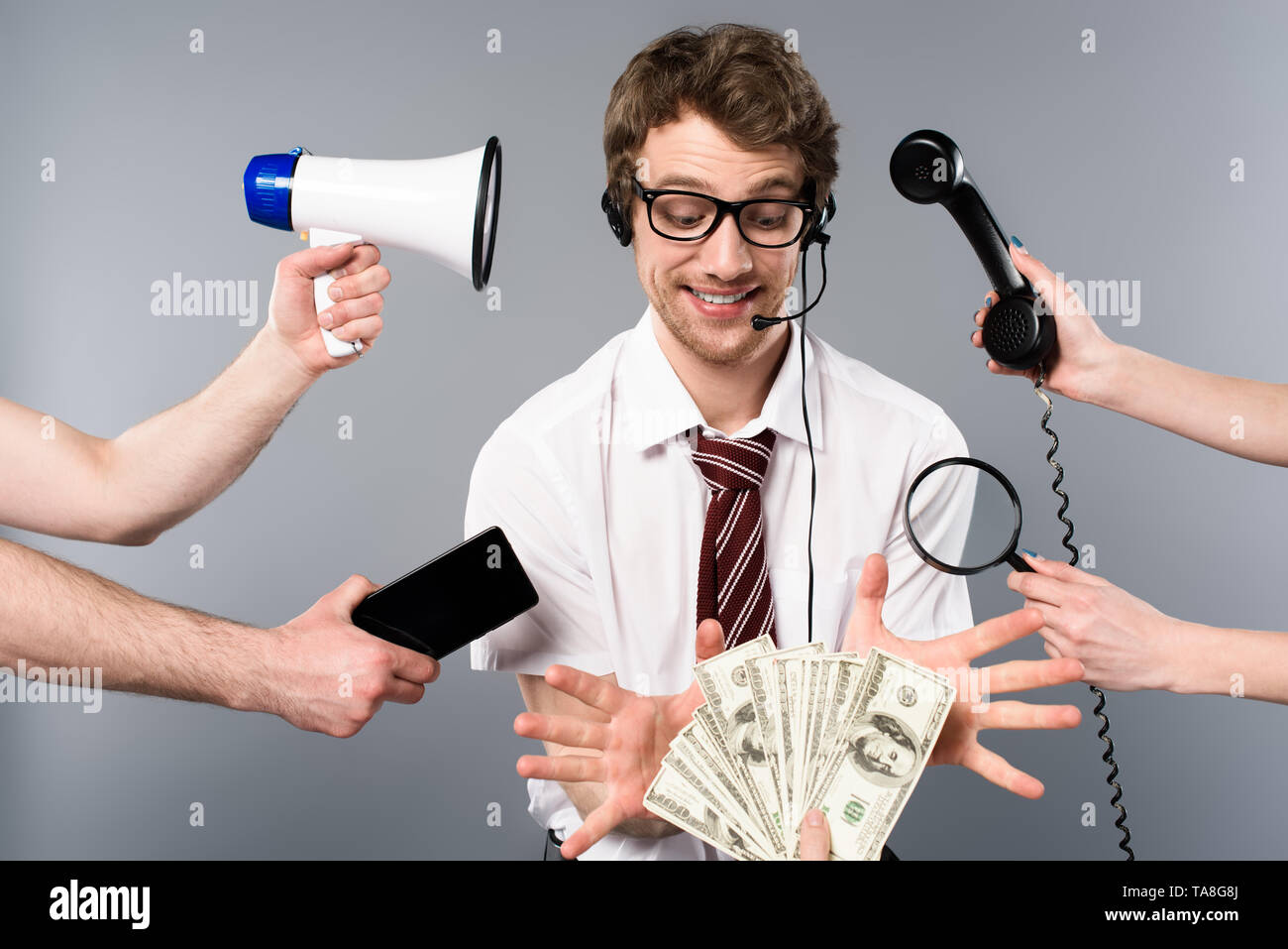smiling call center operator in headset near megaphone, smartphone ...