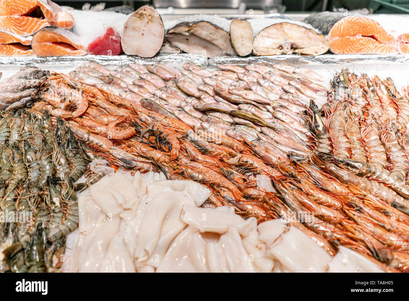 Fresh fish, cuttlefish and shrimp for sale at the fish market France ...