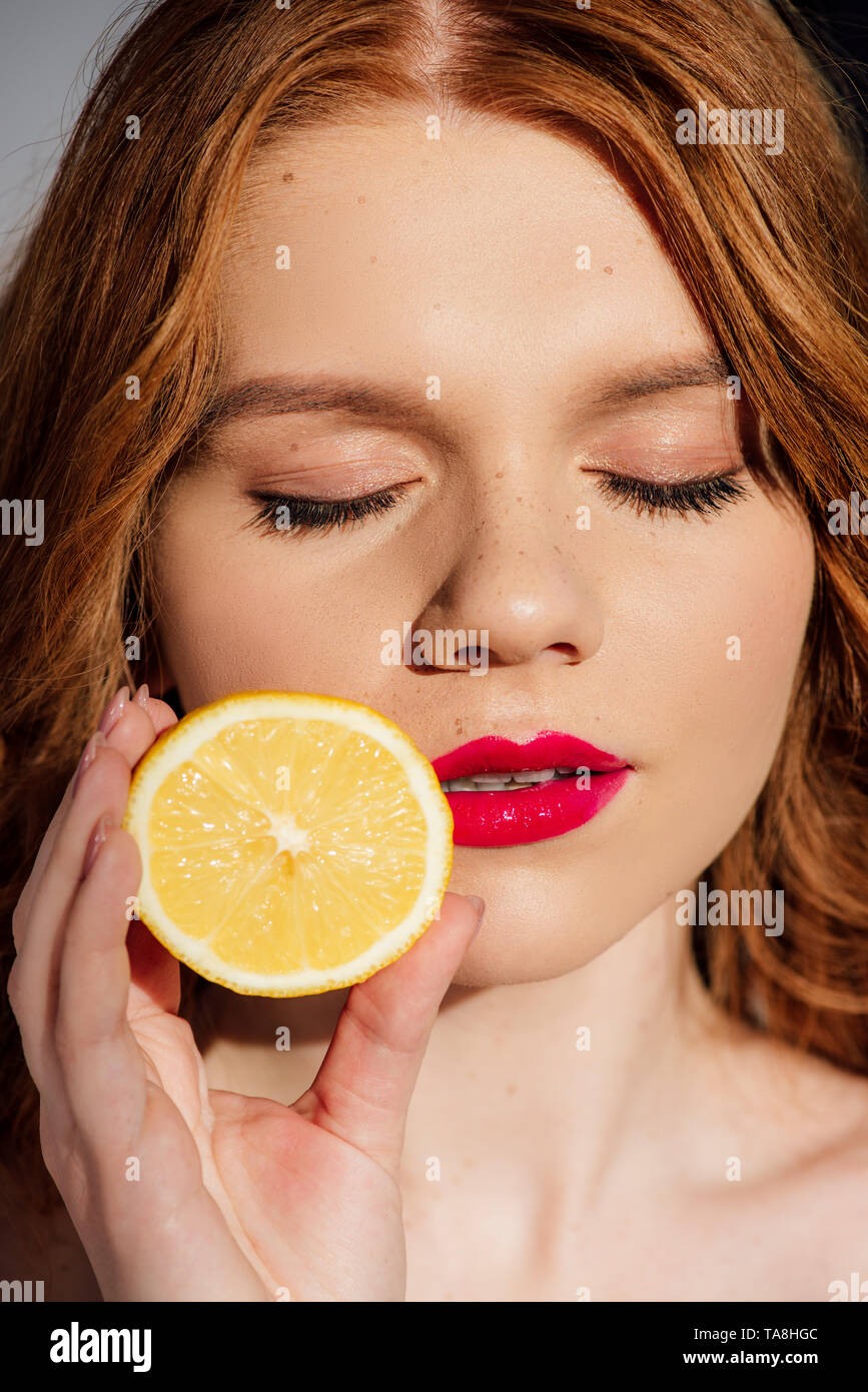 Beautiful Sensual Redhead Girl With Red Lips And Eyes Closed Posing