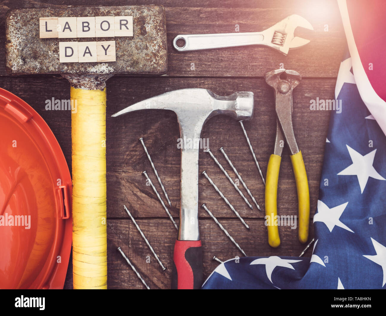 LABOR DAY. American Flag, hand tools and wooden letters of the alphabet ...