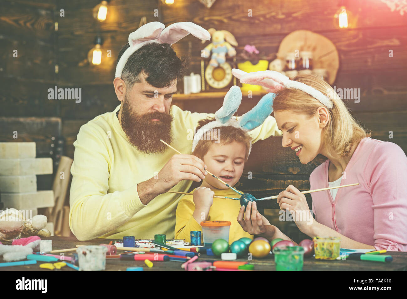Happy family preparing for Easter Stock Photo - Alamy
