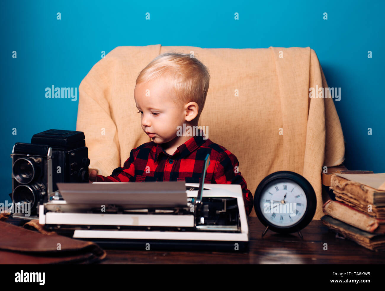 Mass media reporter at work in office. Little journalist prepare press ...