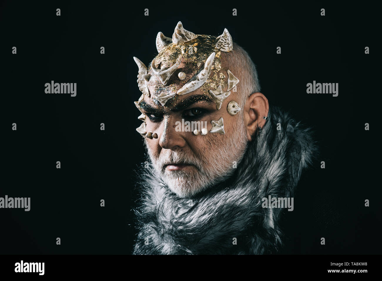 Alien, demon, sorcerer makeup. Senior man with white beard dressed like ...