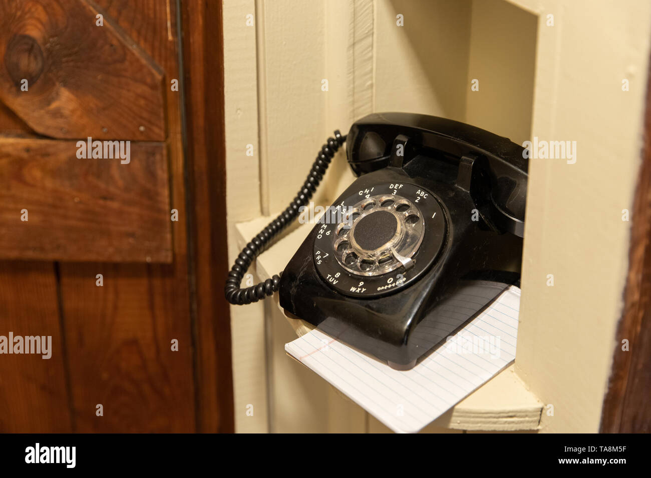 Old black rotary phone in hallway phone nook Stock Photo - Alamy