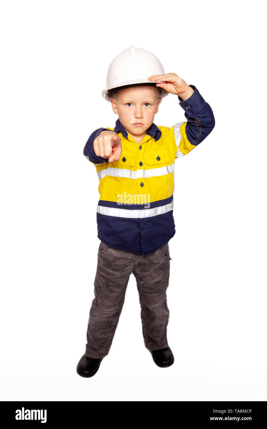 Young blond caucasian boy pointing out, fierce angry look role playing ...