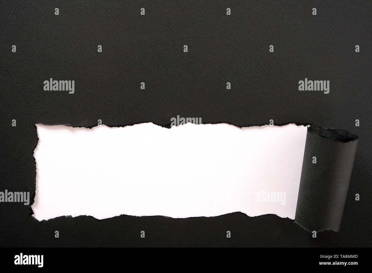 Torn black paper white background straight Stock Photo - Alamy