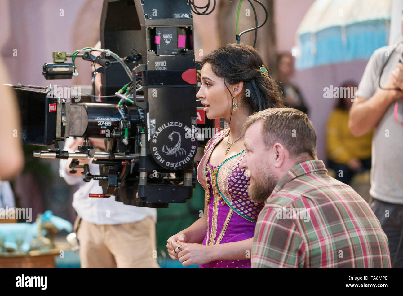 ALADDIN, from left: Naomi Scott, director Guy Ritchie, on set, 2019. ph ...