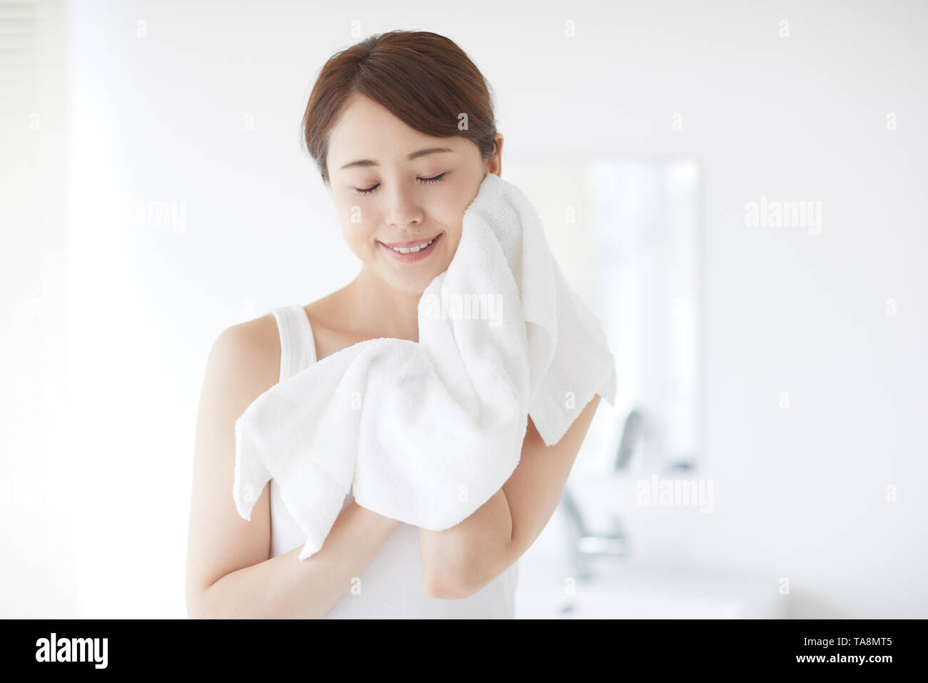 Young Japanese woman at home getting ready in the morning Stock Photo ...