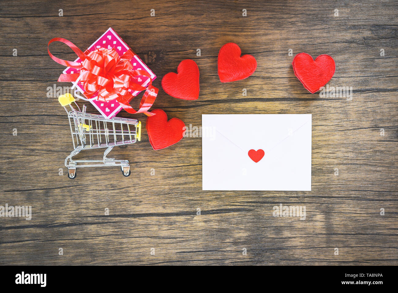 Valentines day shopping and red heart gift box on shopping cart and ...