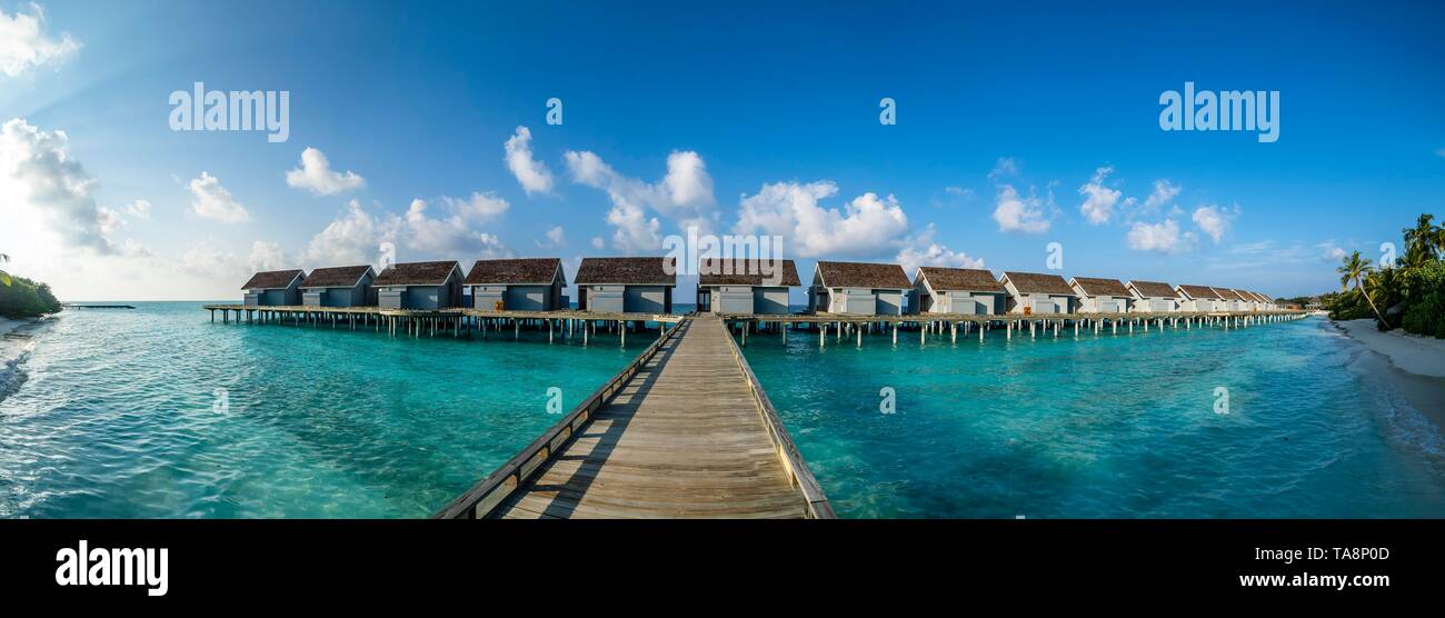 Hotel complex with stilt houses in turquoise water, resort, hotel ...