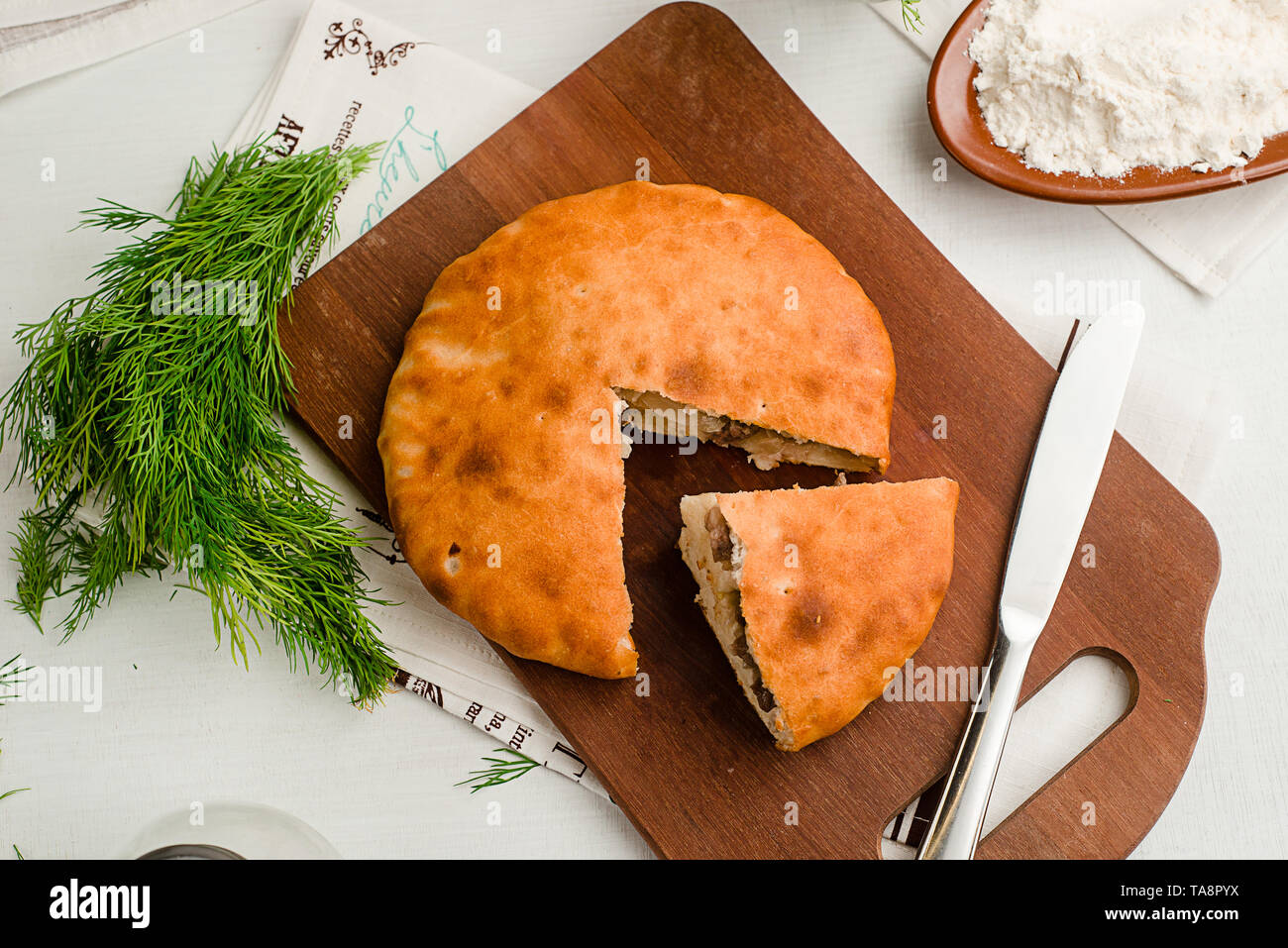 Savory traditional Russian pie with meat and dill. Showing ingredients ...