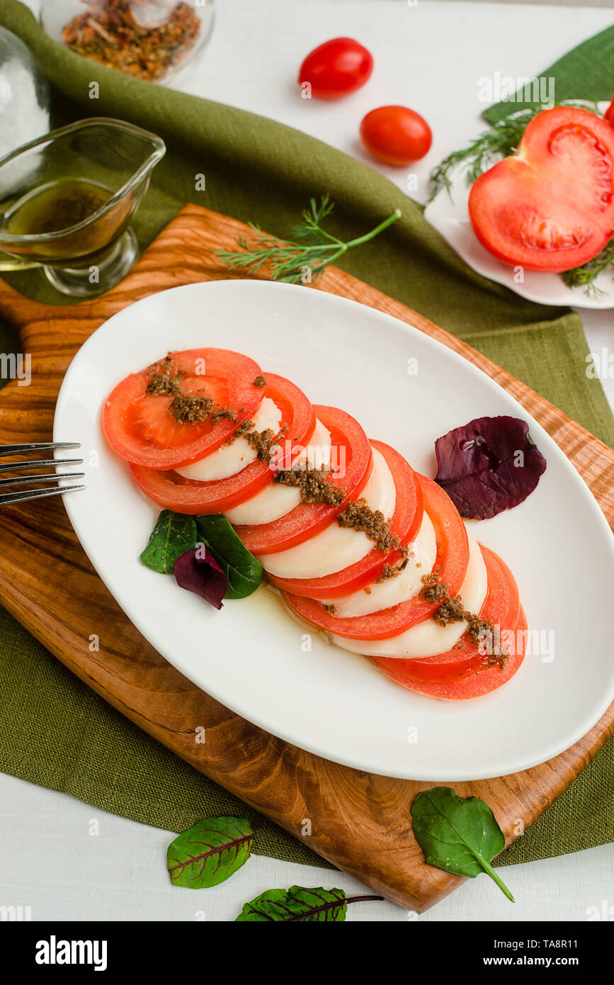 Caprese with tomato, cheese, and balsamic sauce. Menu for a cafe with ...