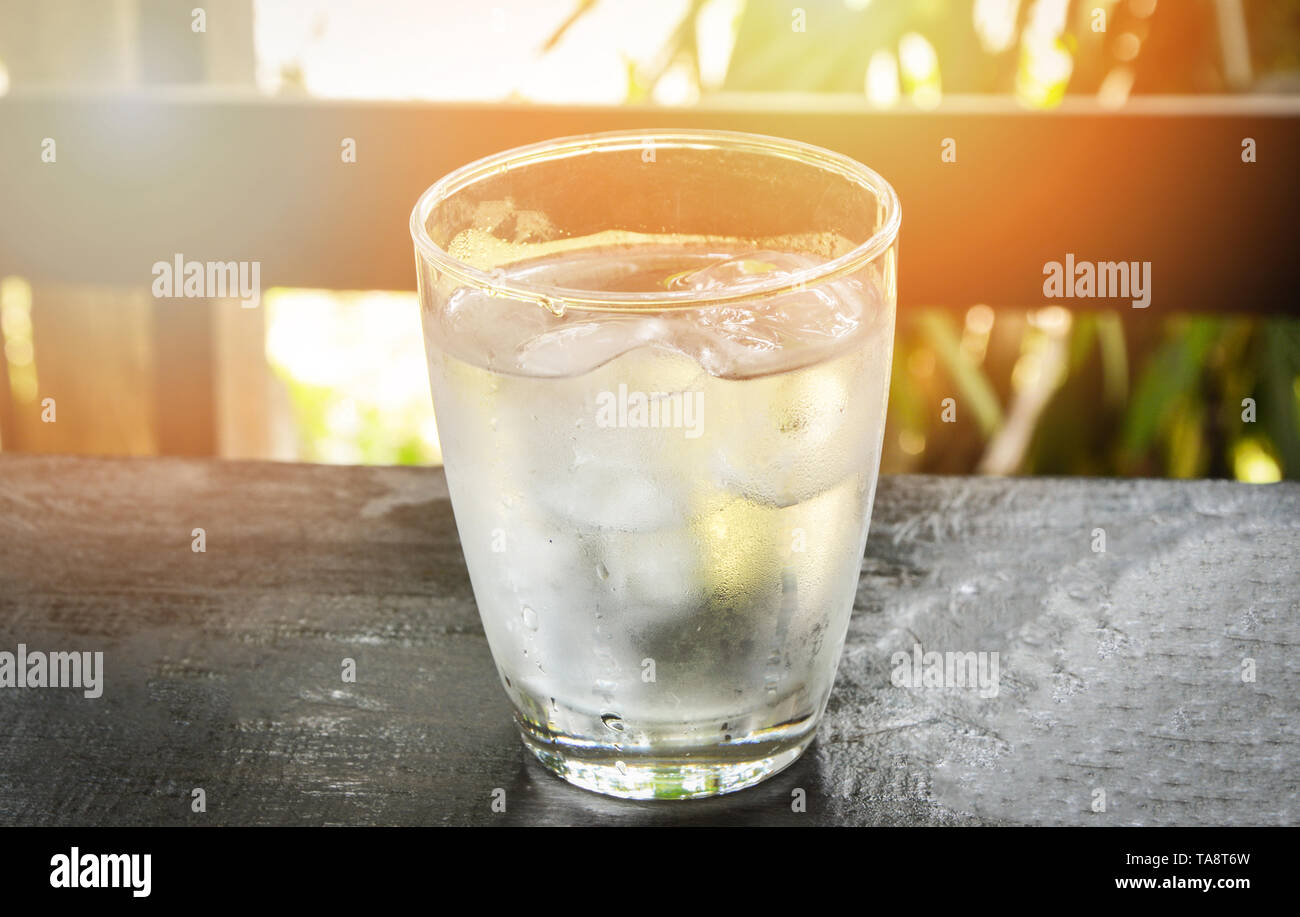 A glass of water with ice cubes in glass on the table Stock Photo - Alamy