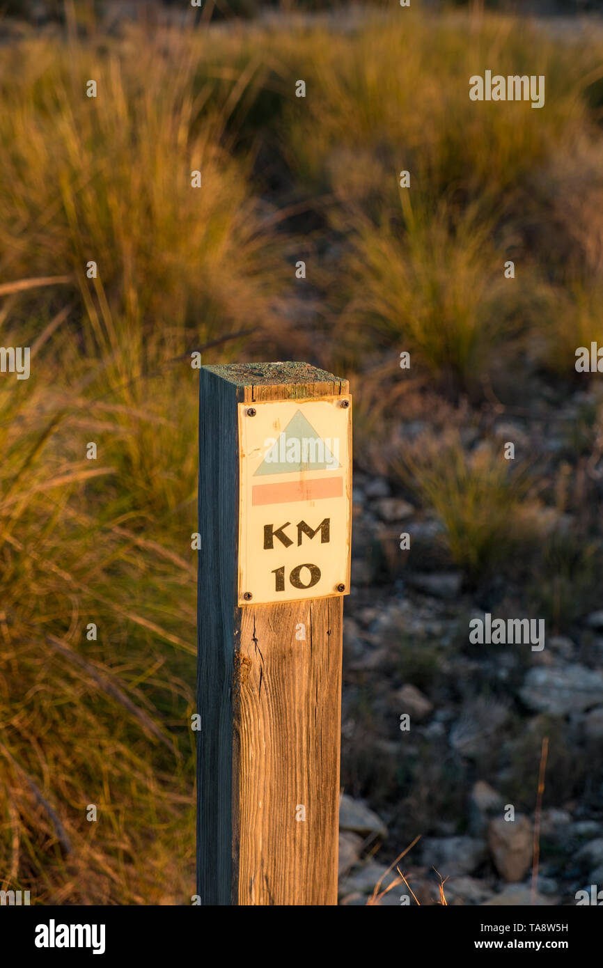 Wooden hiking signpost marking the distance Stock Photo - Alamy
