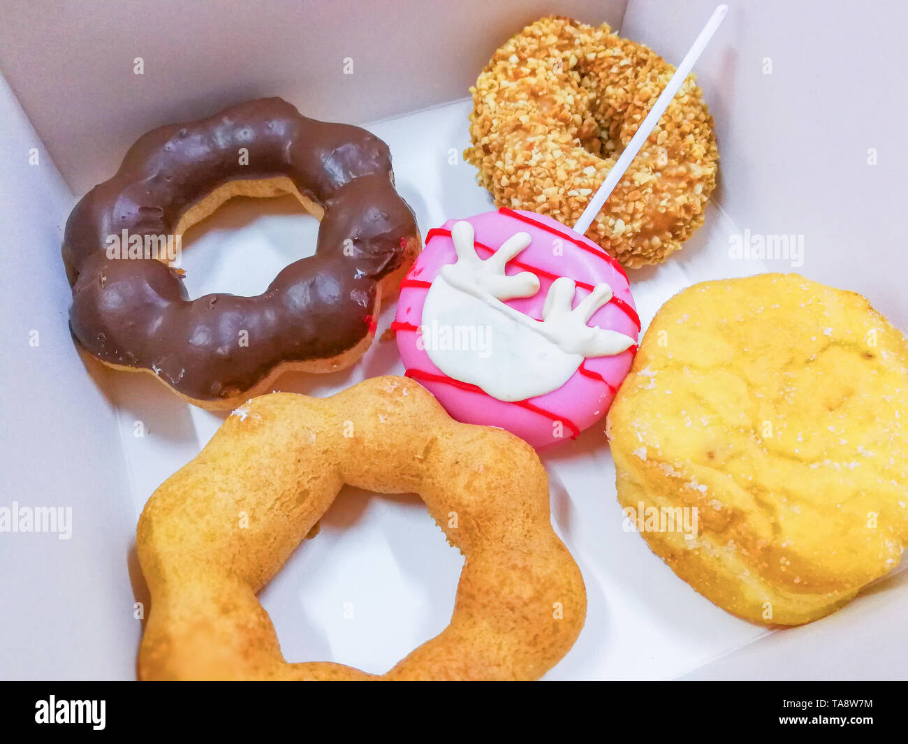 Set of different shape glazed sweet donuts in box delicious dessert or ...