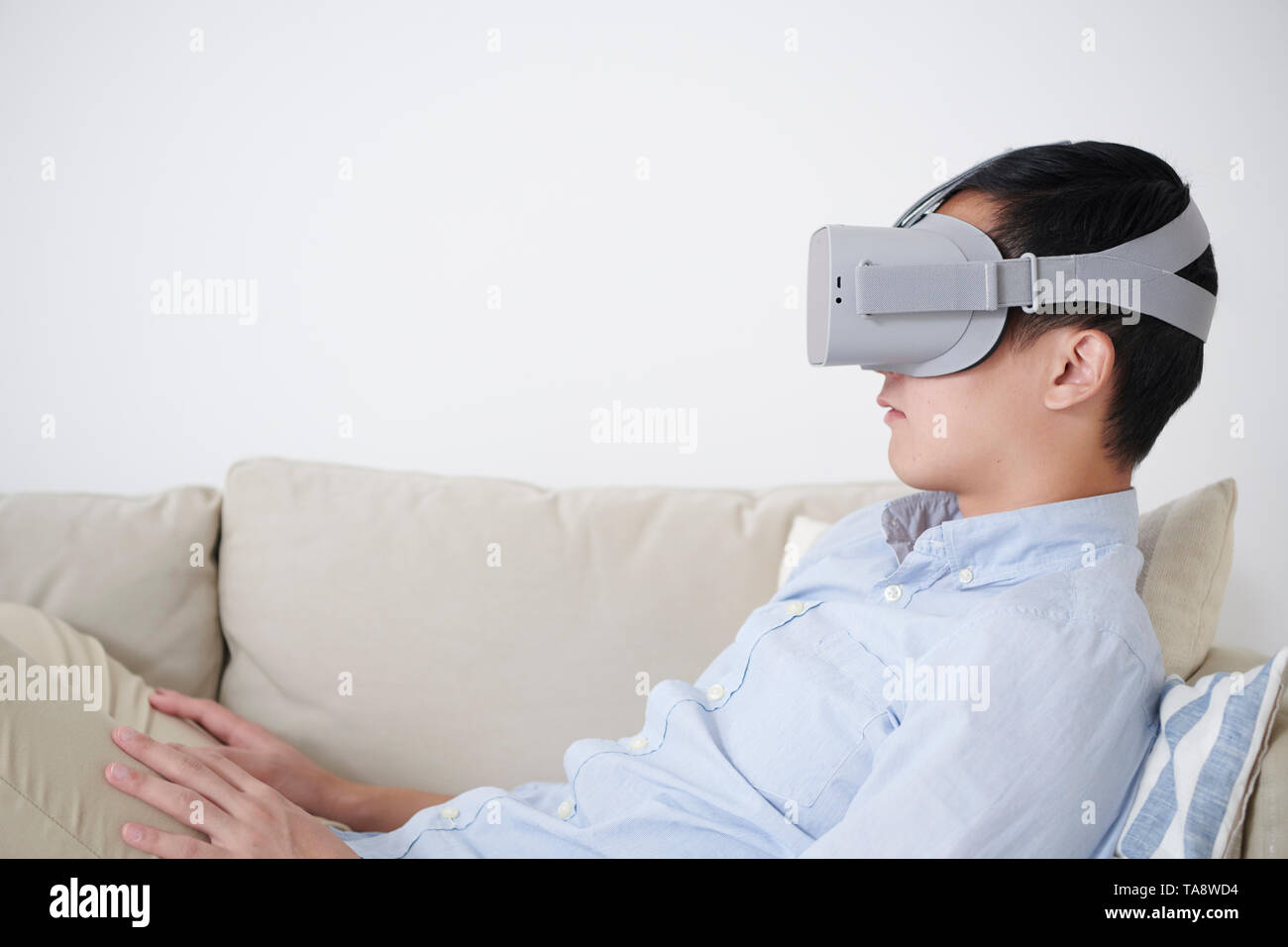 Young Japanese man using VR goggles Stock Photo - Alamy