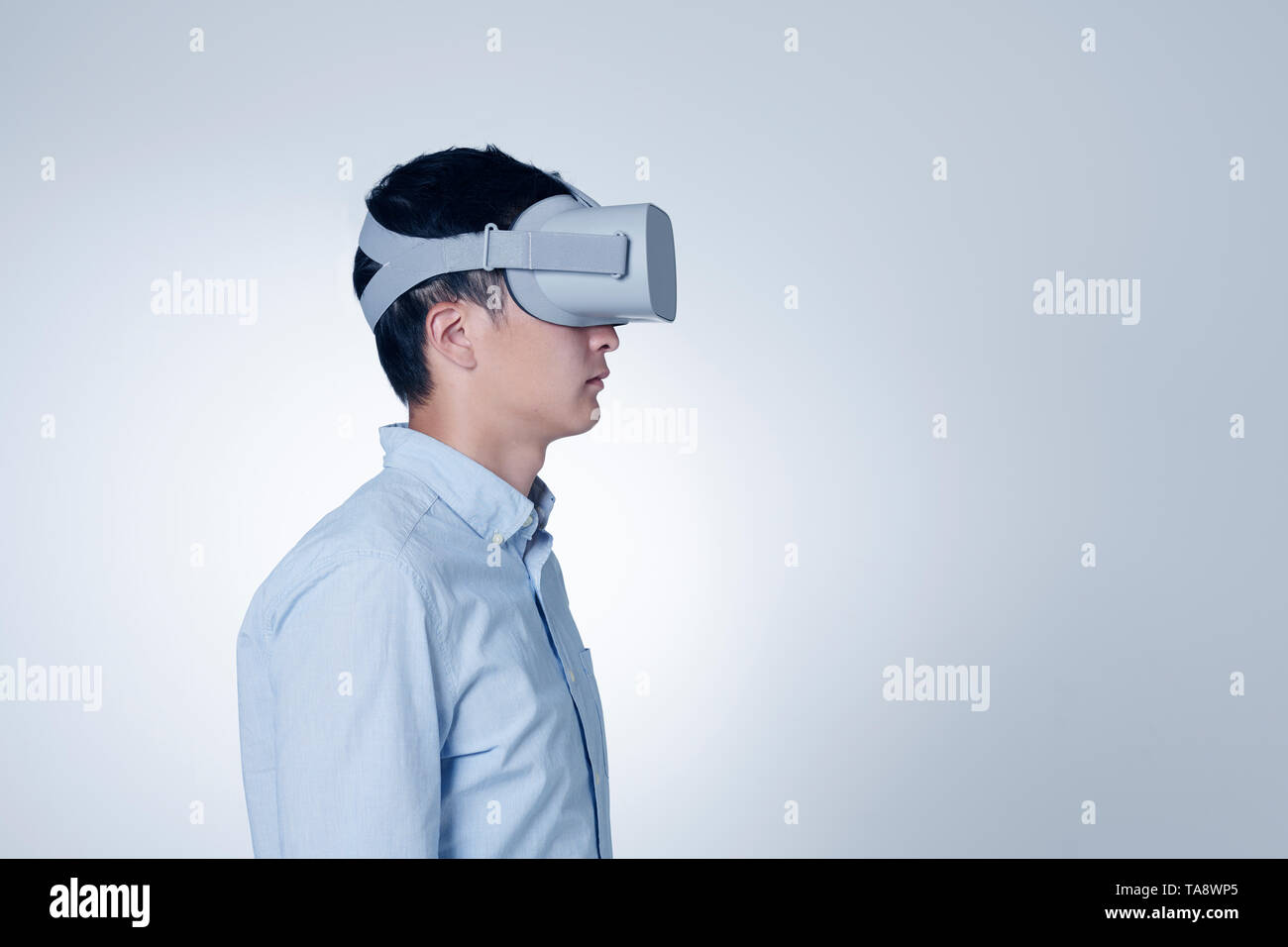 Young Japanese man using VR goggles Stock Photo - Alamy