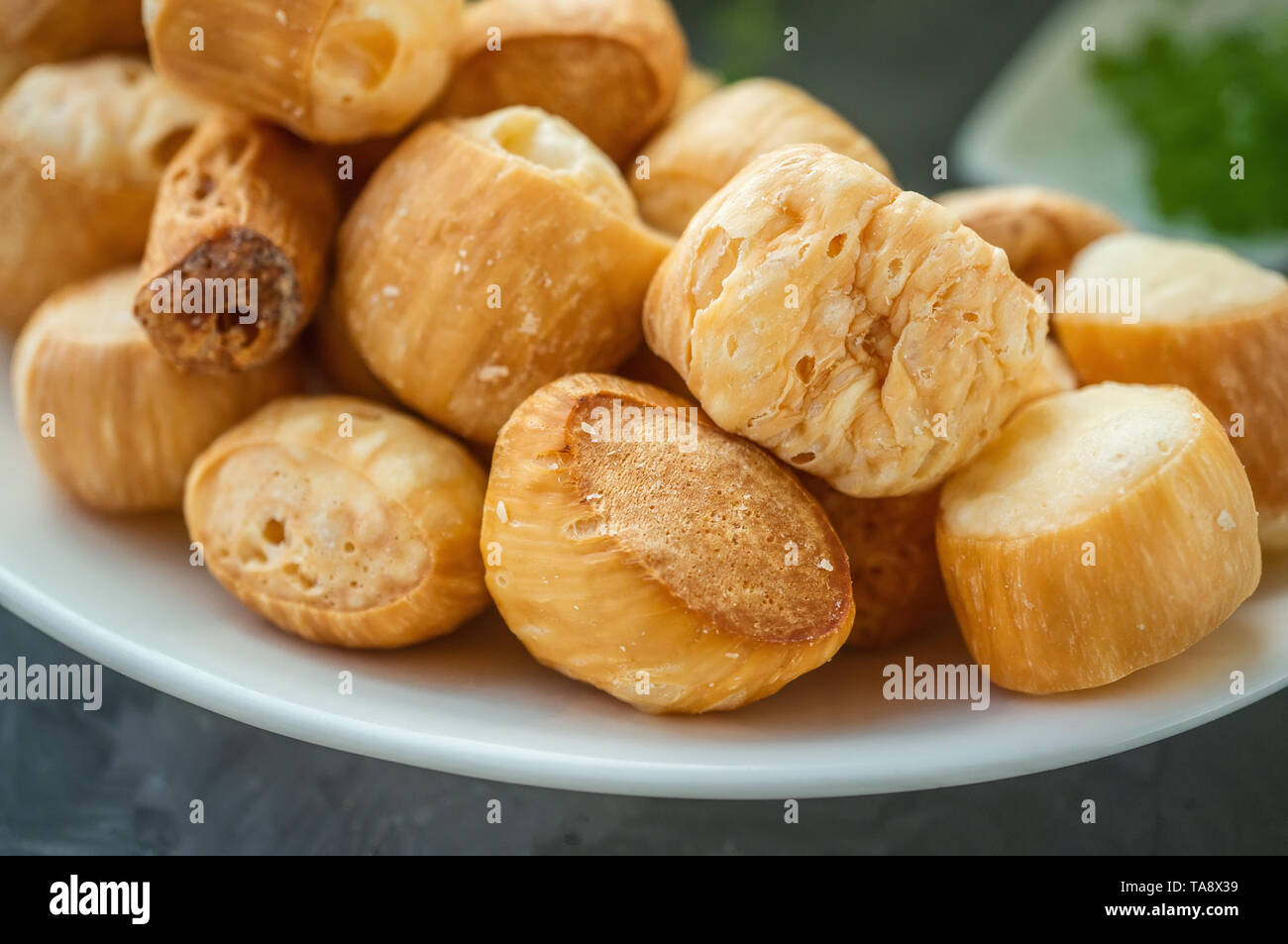 Dry, foamed, smoked, barrel cheese. A quick snack of cheese Chechil and ...
